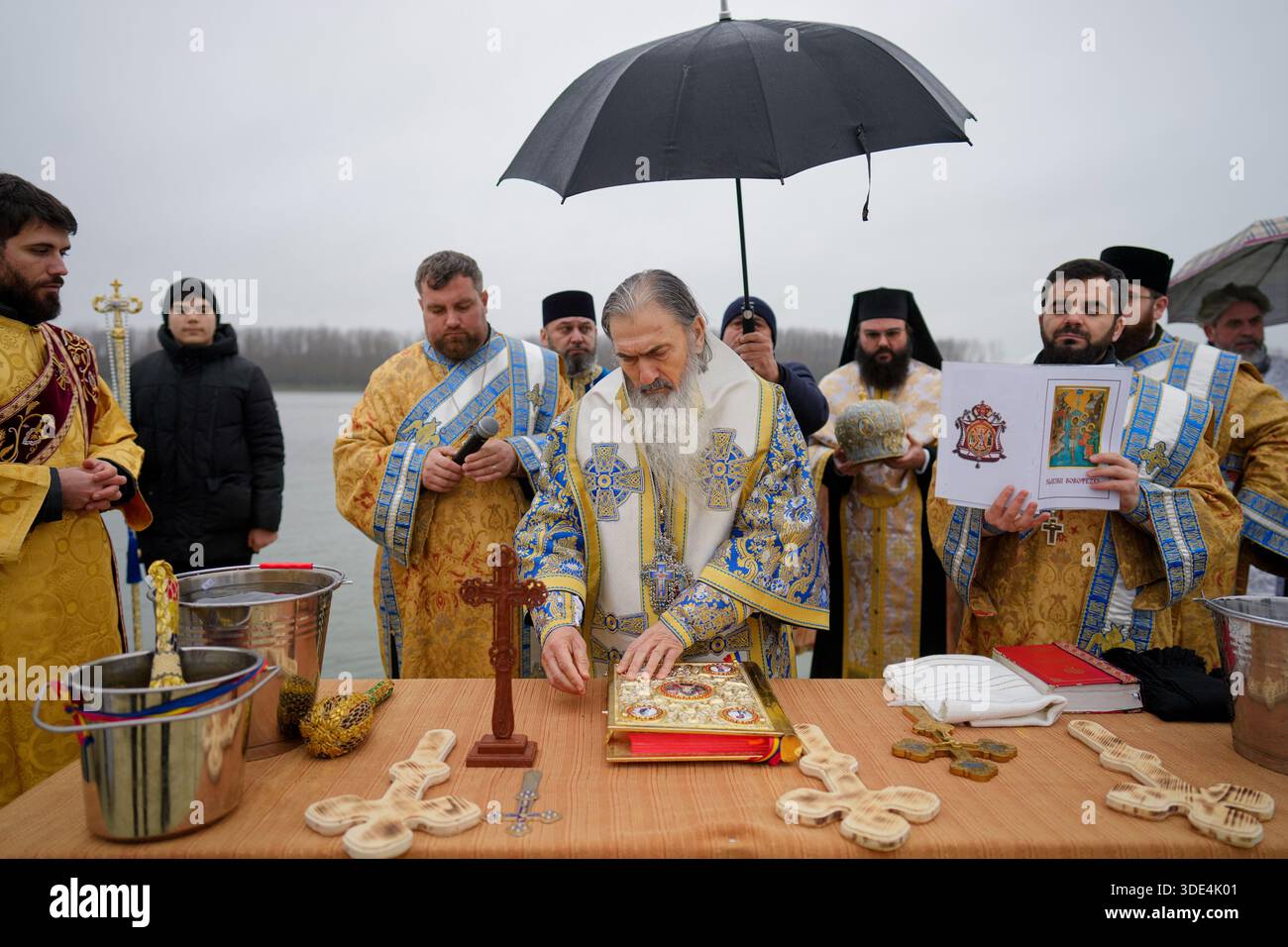 Orthodox archbishop Teodosie, centre, prepares for a religious service ...