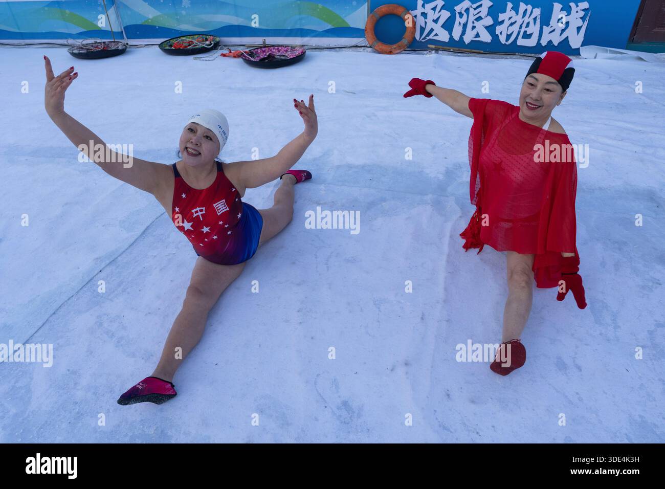 Winter swimmers dance before jumping into icy water in Harbin in China ...