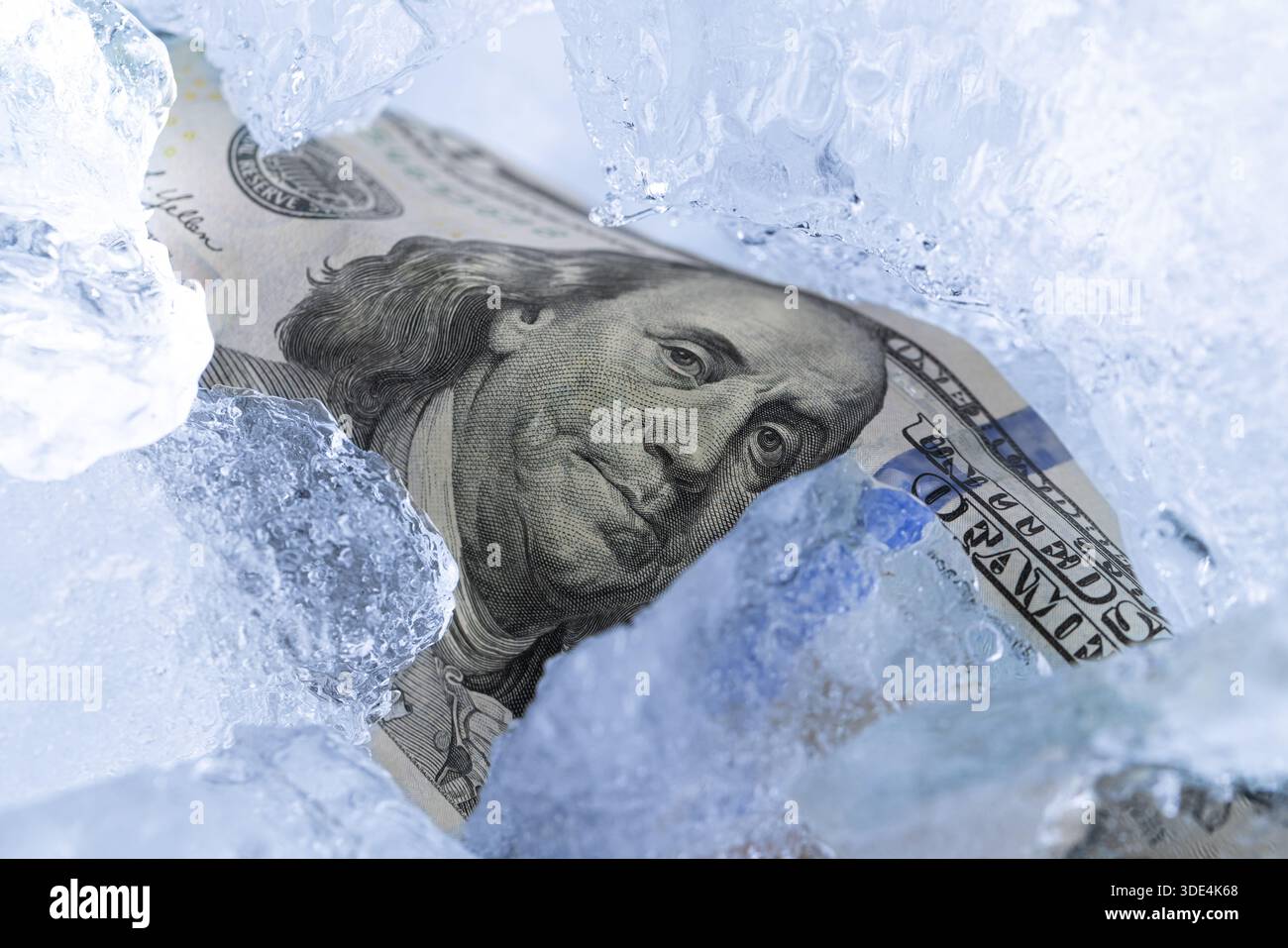 One Hundred Dollar Bill Frozen in Ice Stock Photo - Alamy