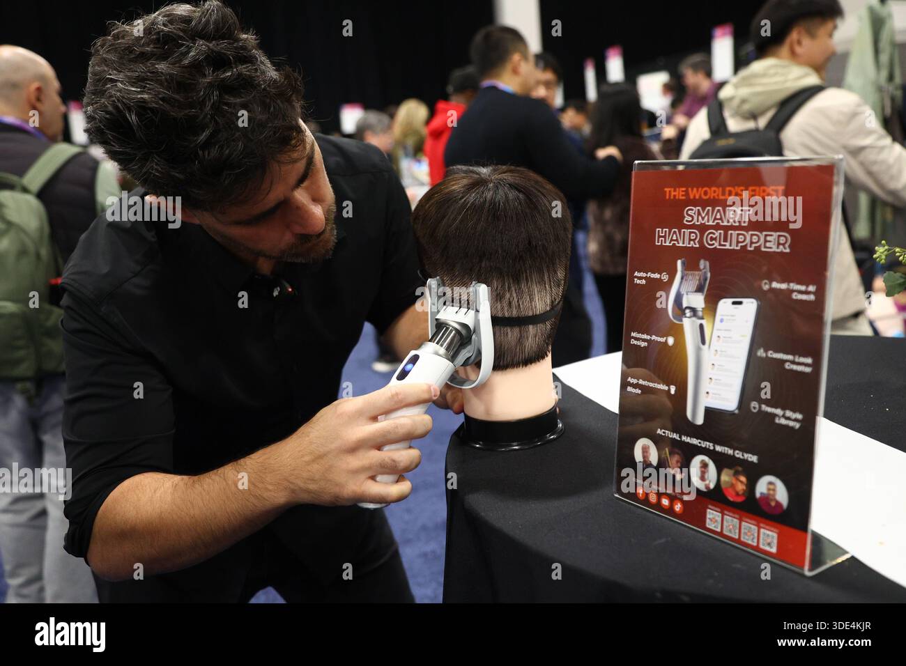 A demonstration of the Glyde smart hair clipper, an AI hair-cutting ...