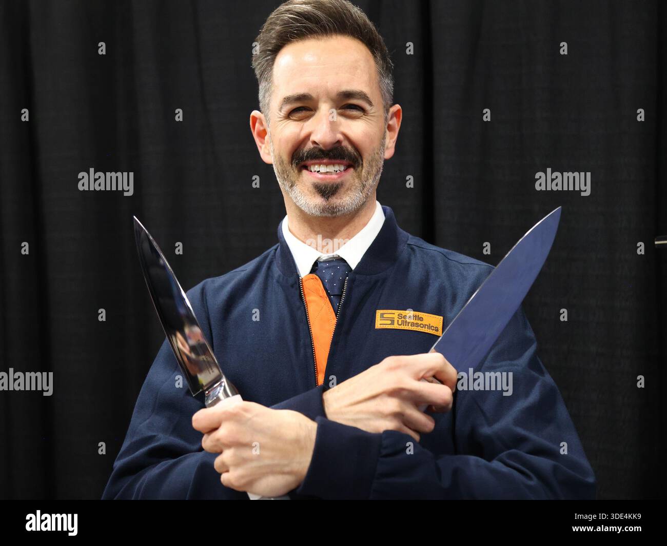 Exhibitor Rand Fishkin with Seattle Ultrasonics poses with the C-200 ...