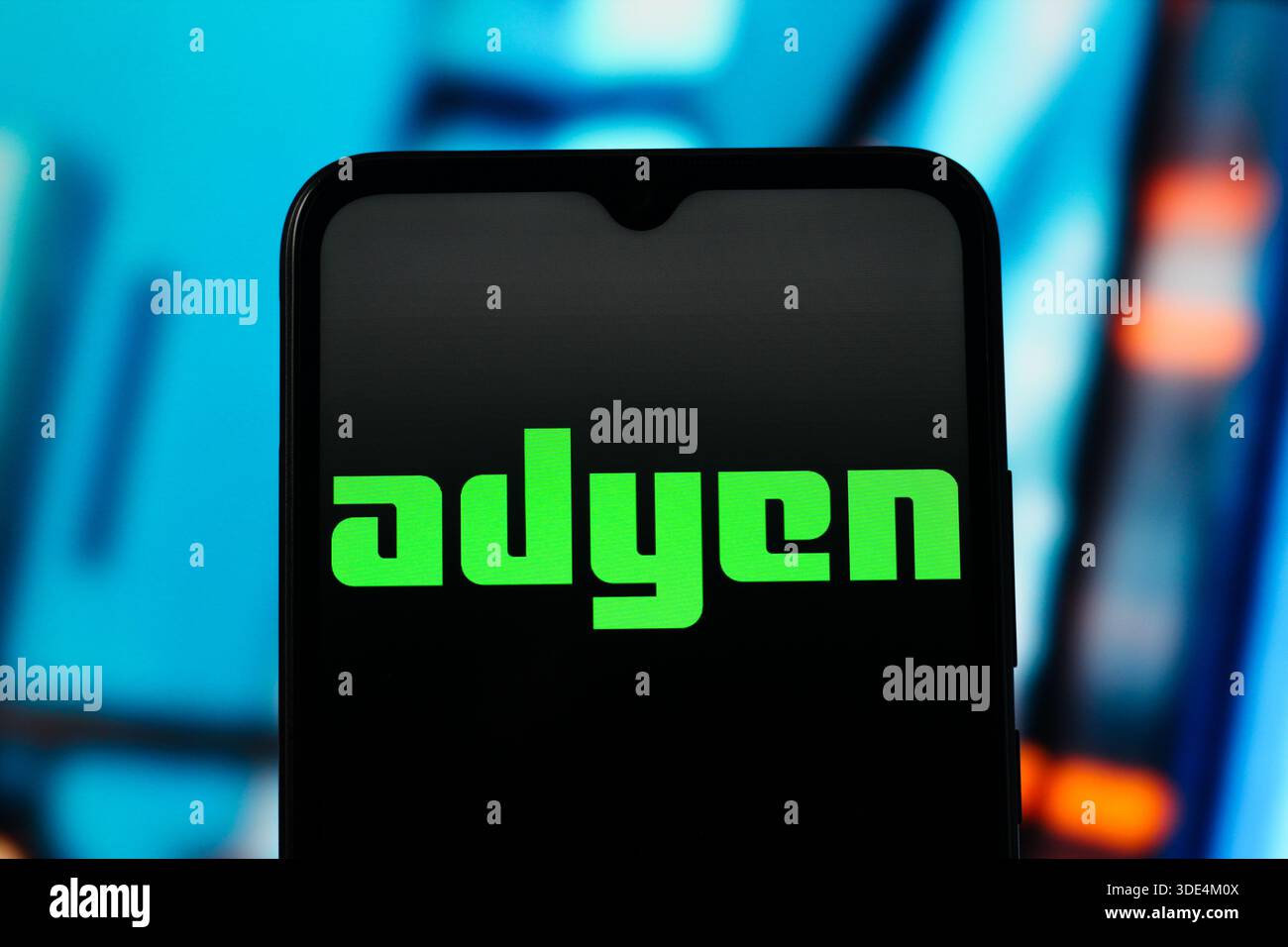In this photo illustration, the Adyen logo is seen displayed on a ...