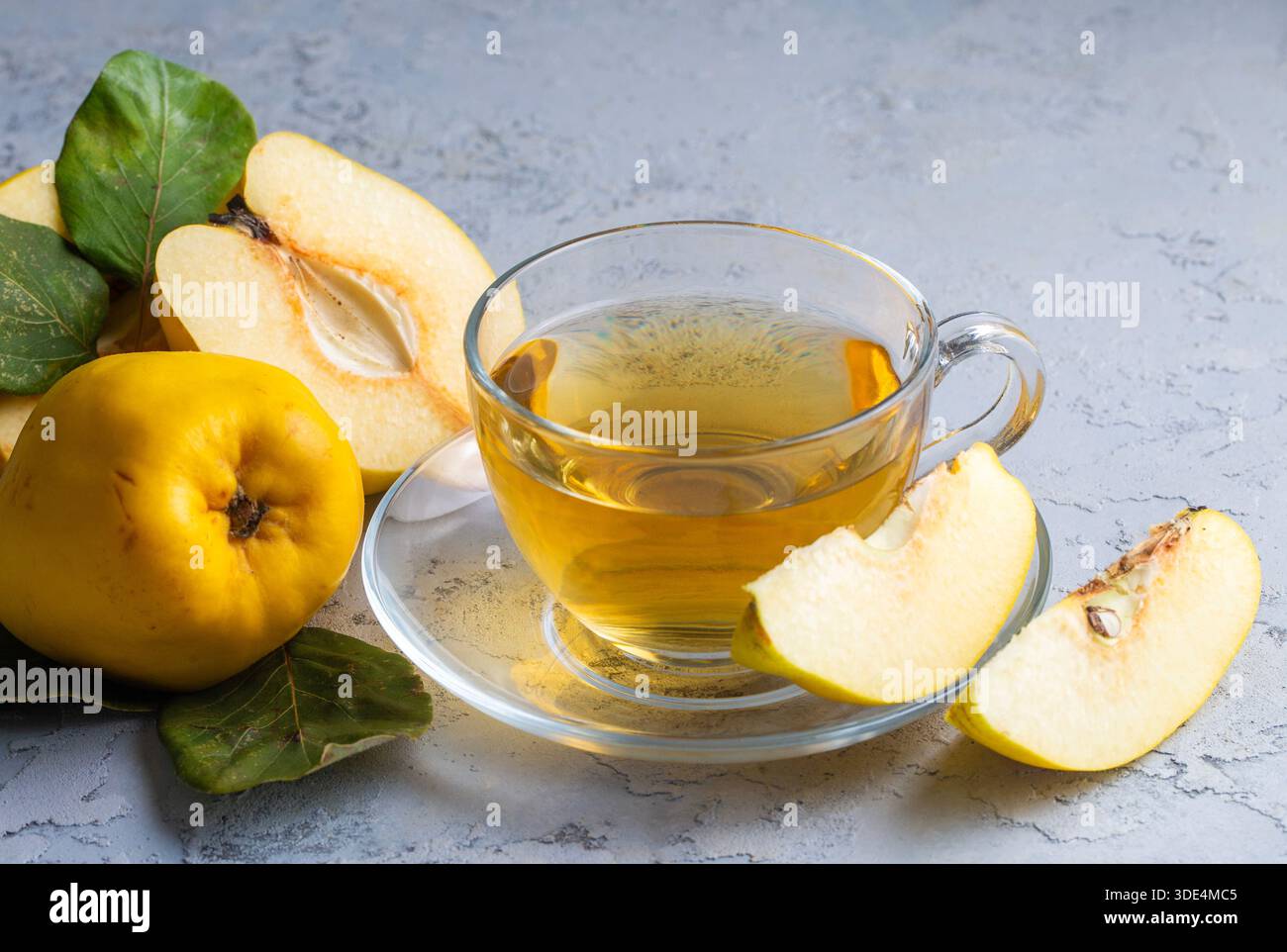 The cup of quince tea and fresh quince fruit Stock Photo - Alamy