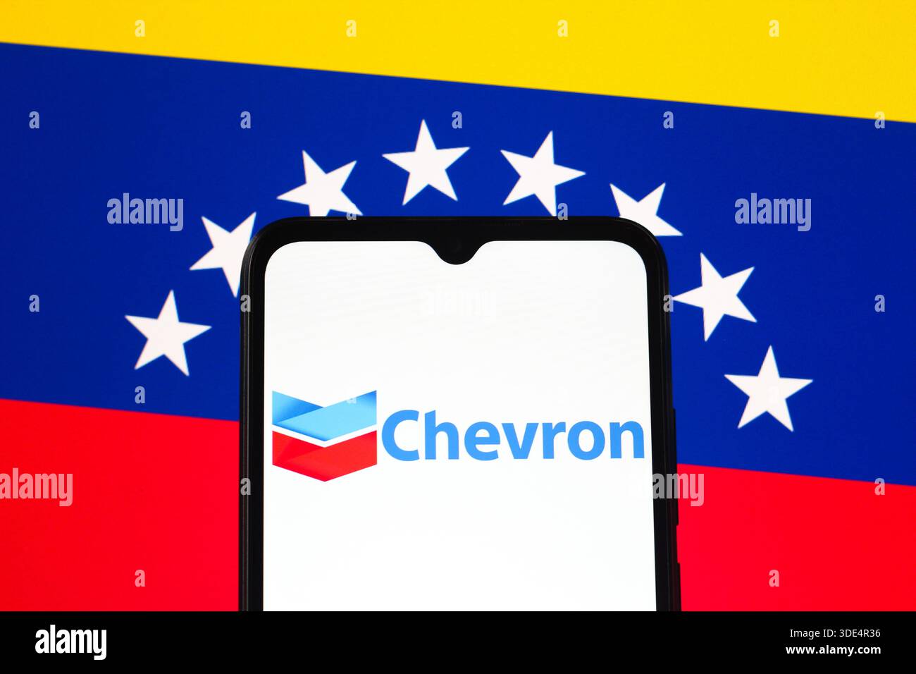 In this photo illustration, the Chevron logo is seen displayed on a ...