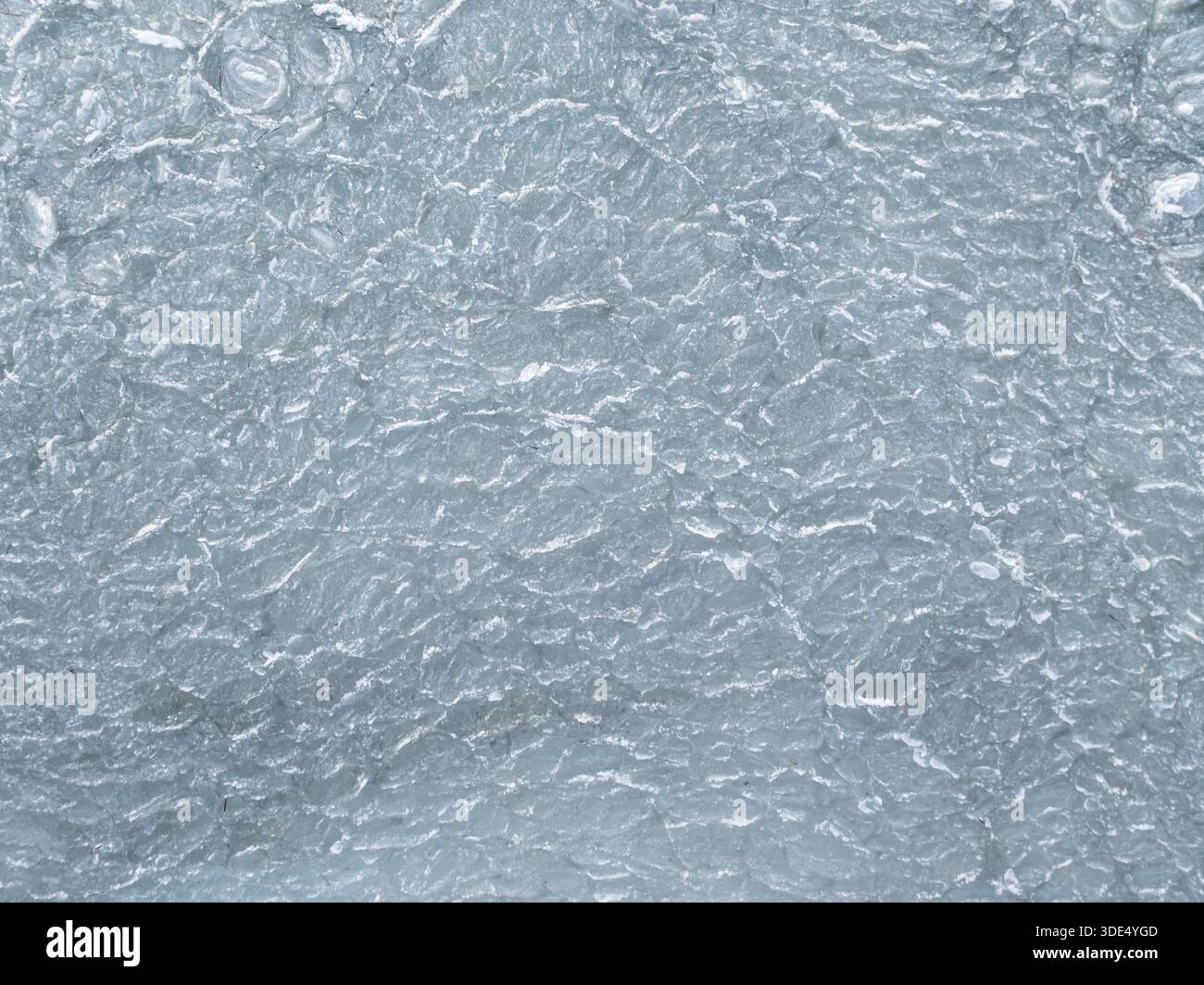 Aerial drone view of frozen Baltic Sea ice texture and slushy water ...