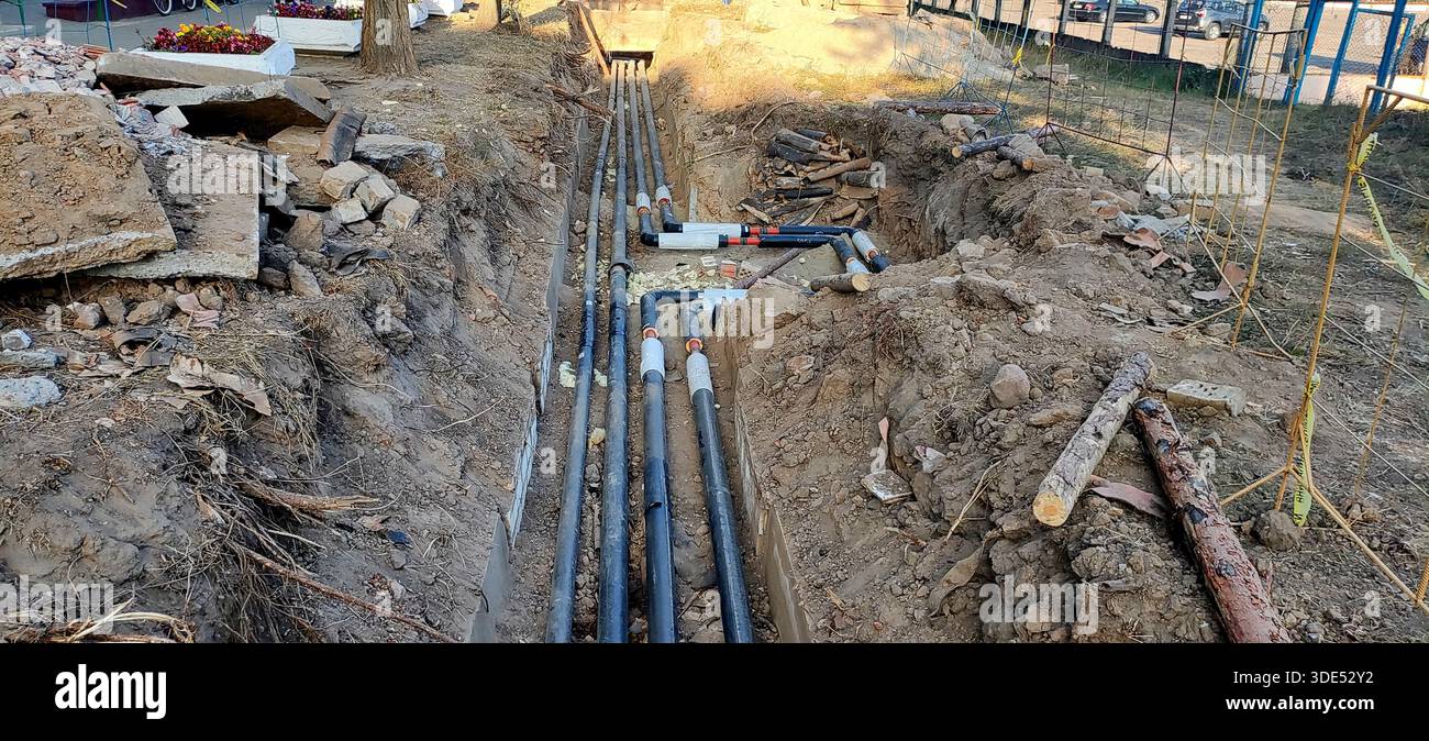 Detailed view open excavation trench for underground pipe installation ...