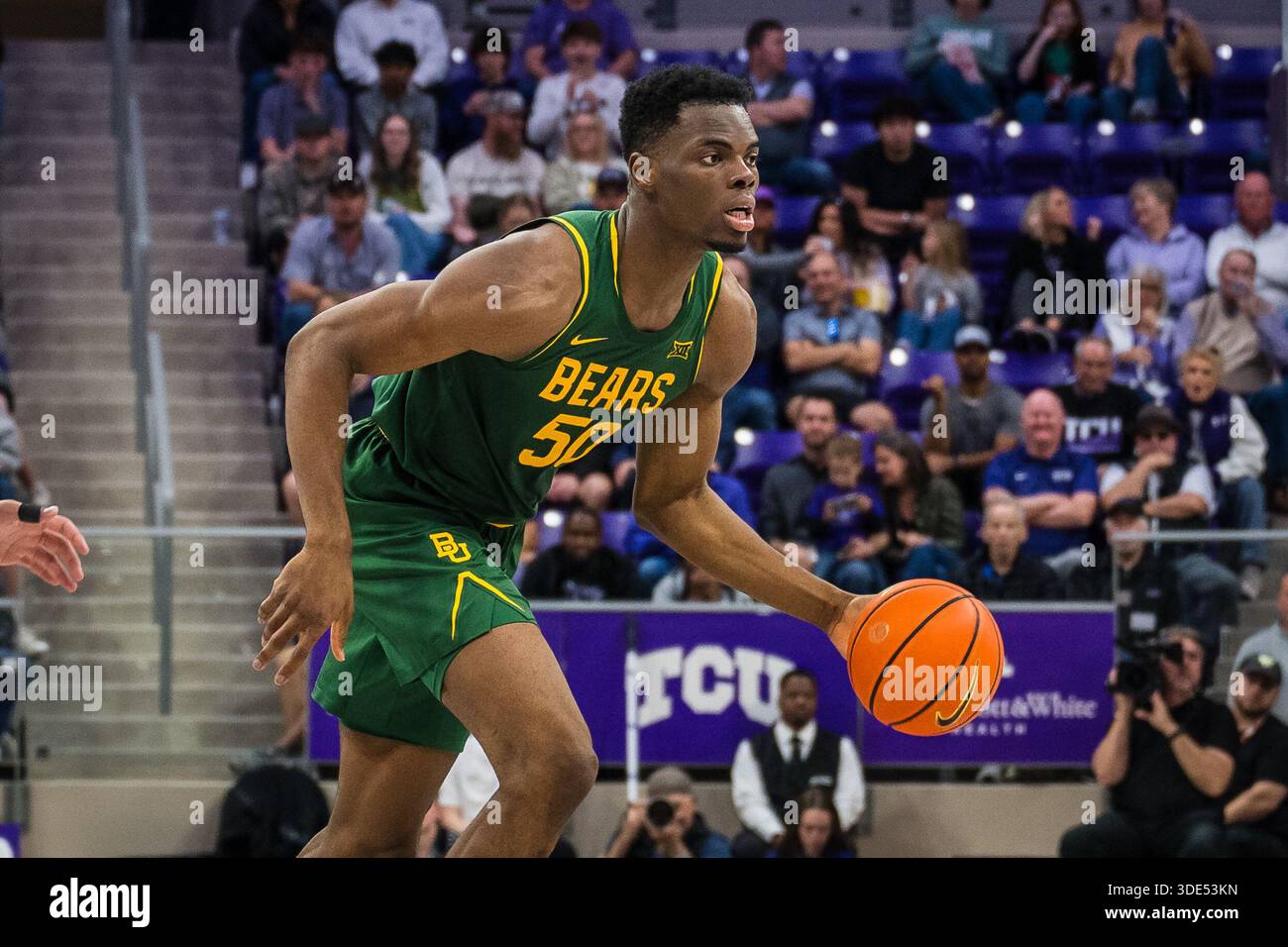 Baylor center James Nnaji dribbles the ball during an NCAA college ...