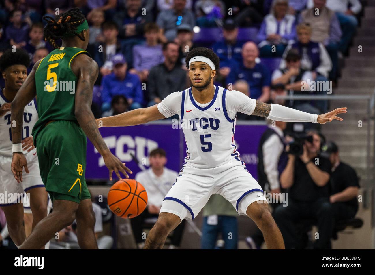 Texas Christian University forward Micah Robinson (5) defends against ...