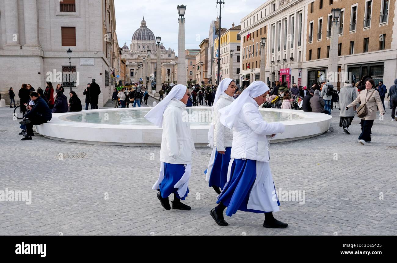 FILE - Nuns walk past a fountain after the inauguration of the new ...