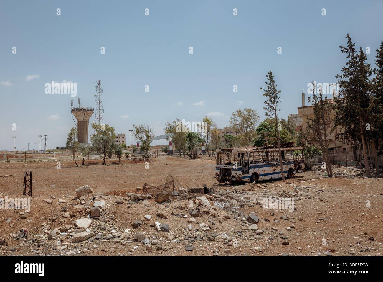 Destroyed bus abandoned after civil war rest in the arid landscape in ...