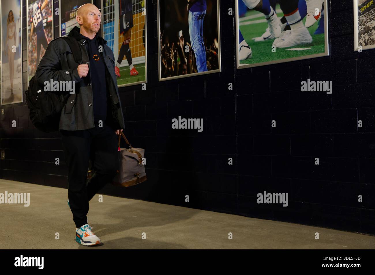 Miami Dolphins offensive line coach Butch Barry enters the stadium ...