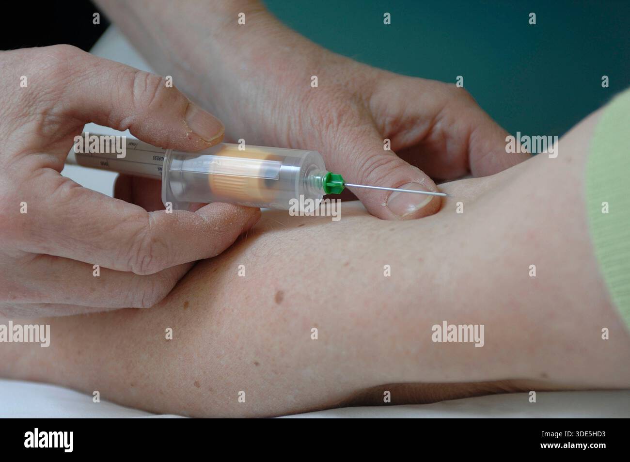 Nurse positioning blood tube in hi-res stock photography and images - Alamy