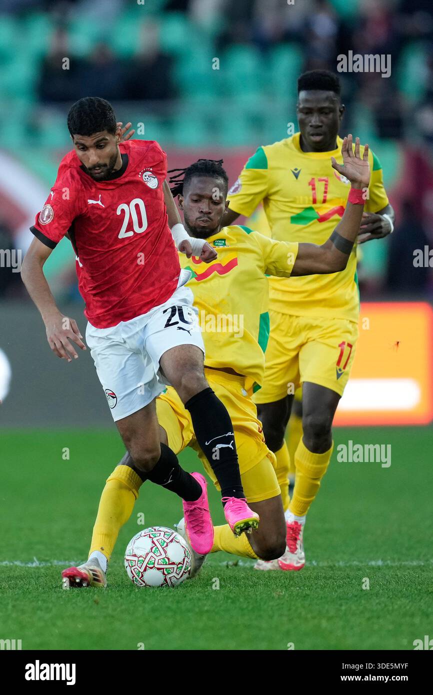 Egypt's Khaled Sobhi, foreground, controls the ball as Benin's Hassane ...
