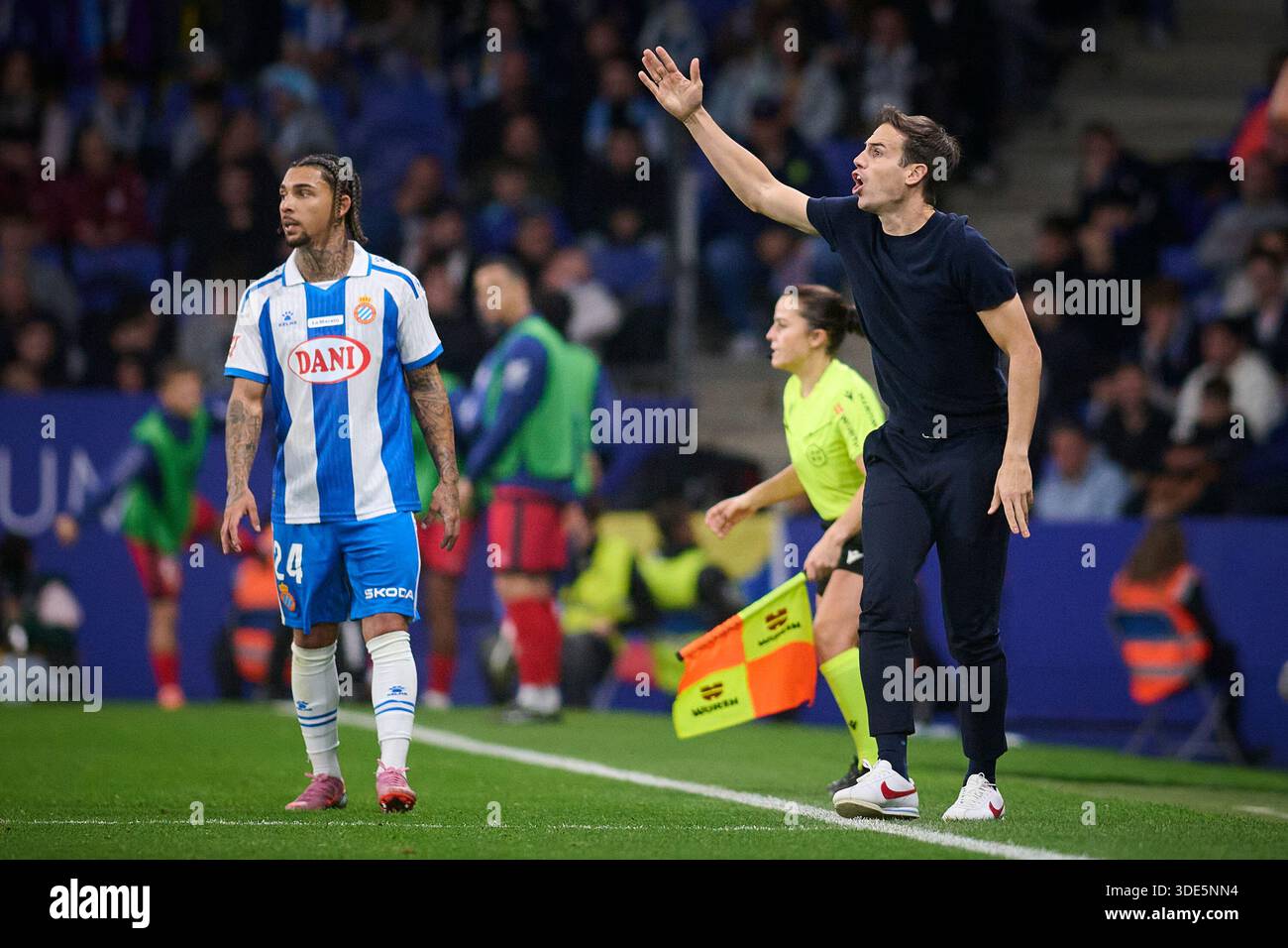 RCD Espanyol's Tyrhys Dolan (L) and Rayo Vallecano's coach Inigo Perez ...