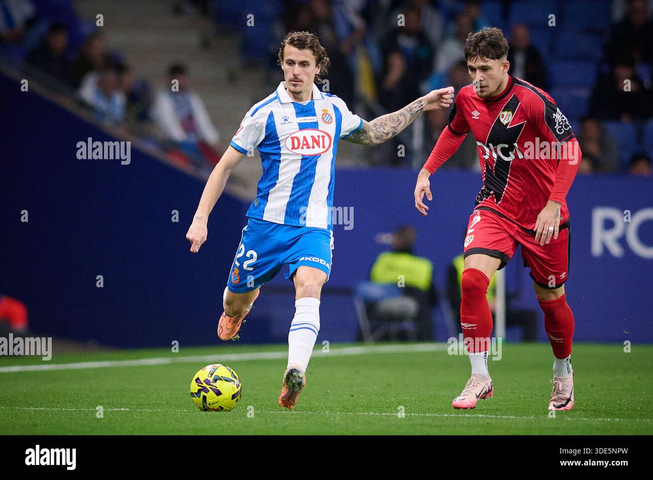 RCD Espanyol's Carlos Romero (L) and Rayo Vallecano's Andrei Ratiu ...