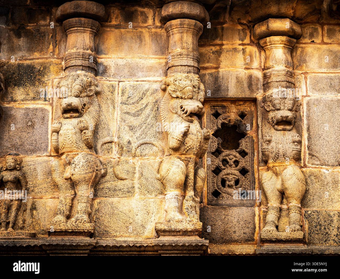 Ancient stone carvings of mythical creatures on a temple wall Stock ...