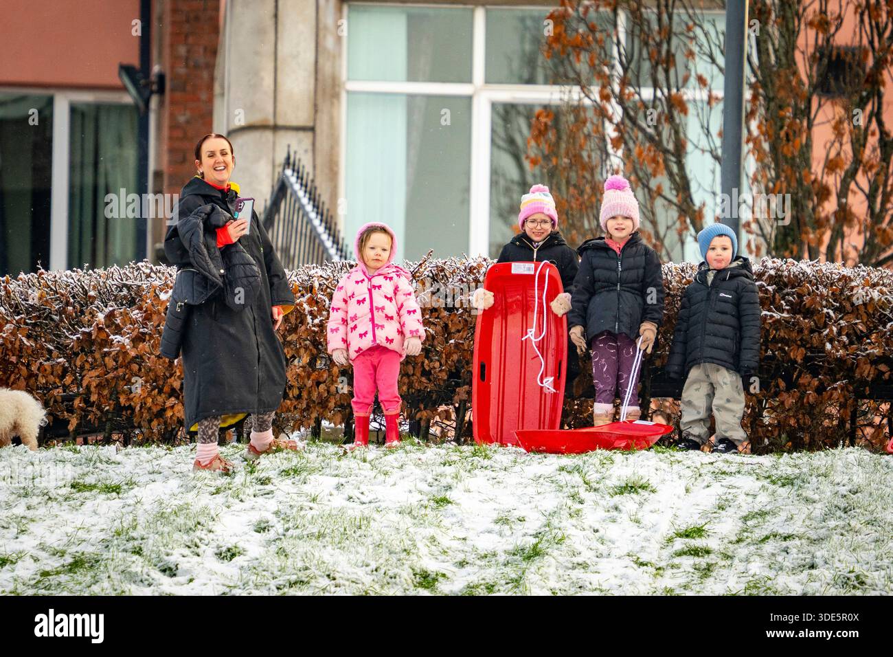 Derry, Northern Ireland. 6 January 2026. Families and children sled ...