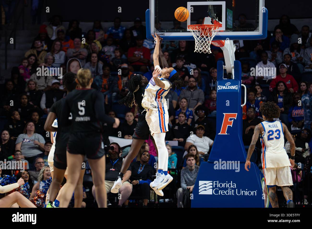 South Carolina center Madina Okot (back) shoots as Florida forward Me ...