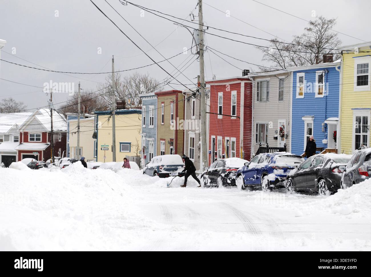 Residents of St. John's, N.L., are shown shovelling out on Monday Jan ...