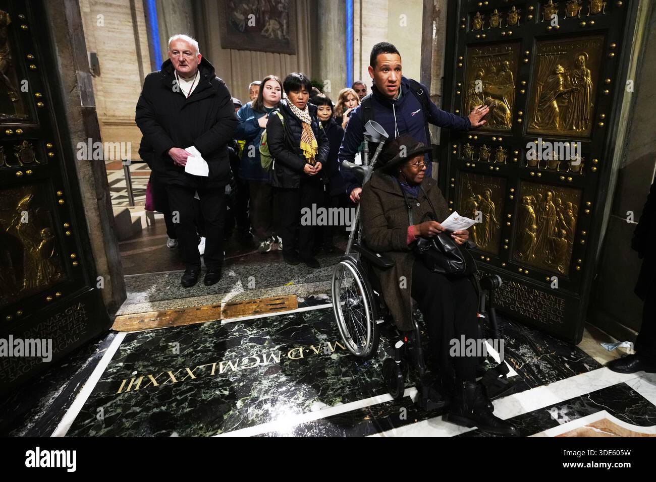 Natalie Turner and her son Phillip cross the Holy Door in St.Peter's ...