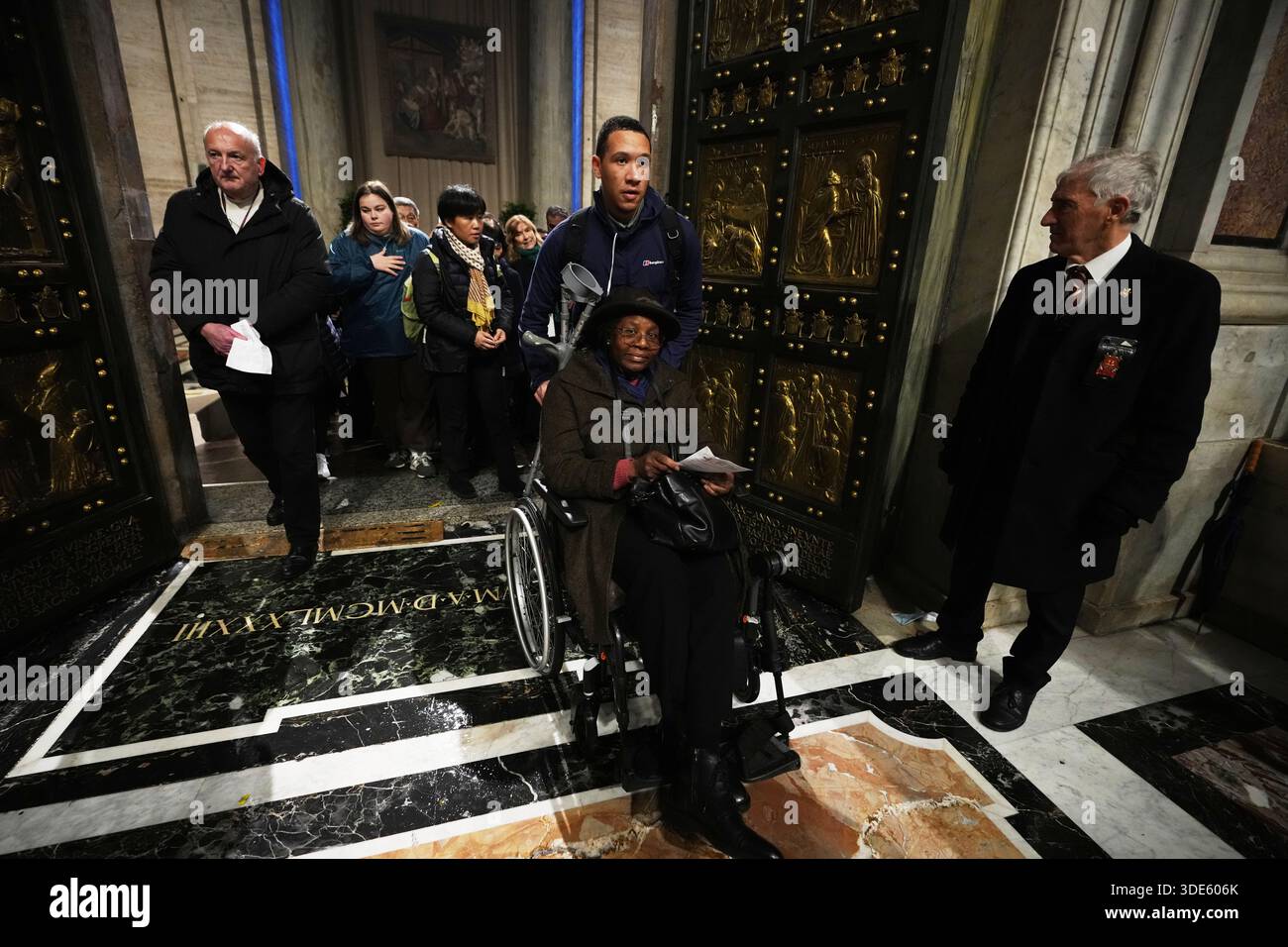 Natalie Turner and her son Phillip cross the Holy Door in St.Peter's ...