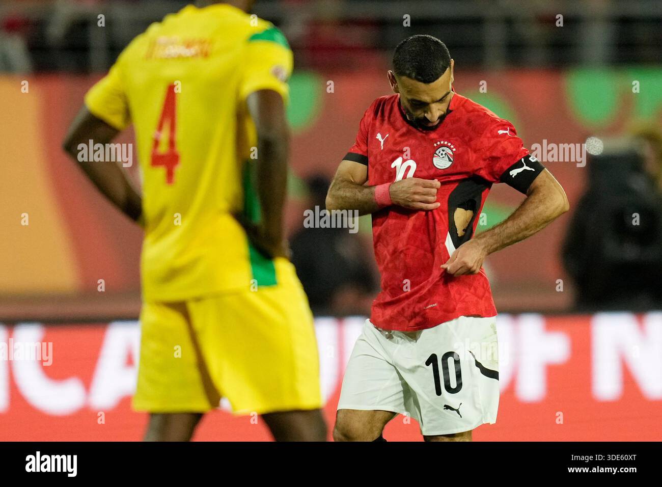Egypt's Mohamed Salah looks at his ripped jersey during the Africa Cup ...