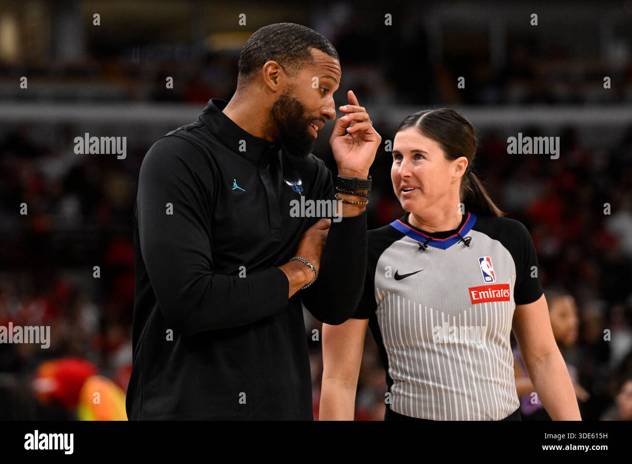 Charlotte Hornets head coach Charles Lee, left, talks with official ...