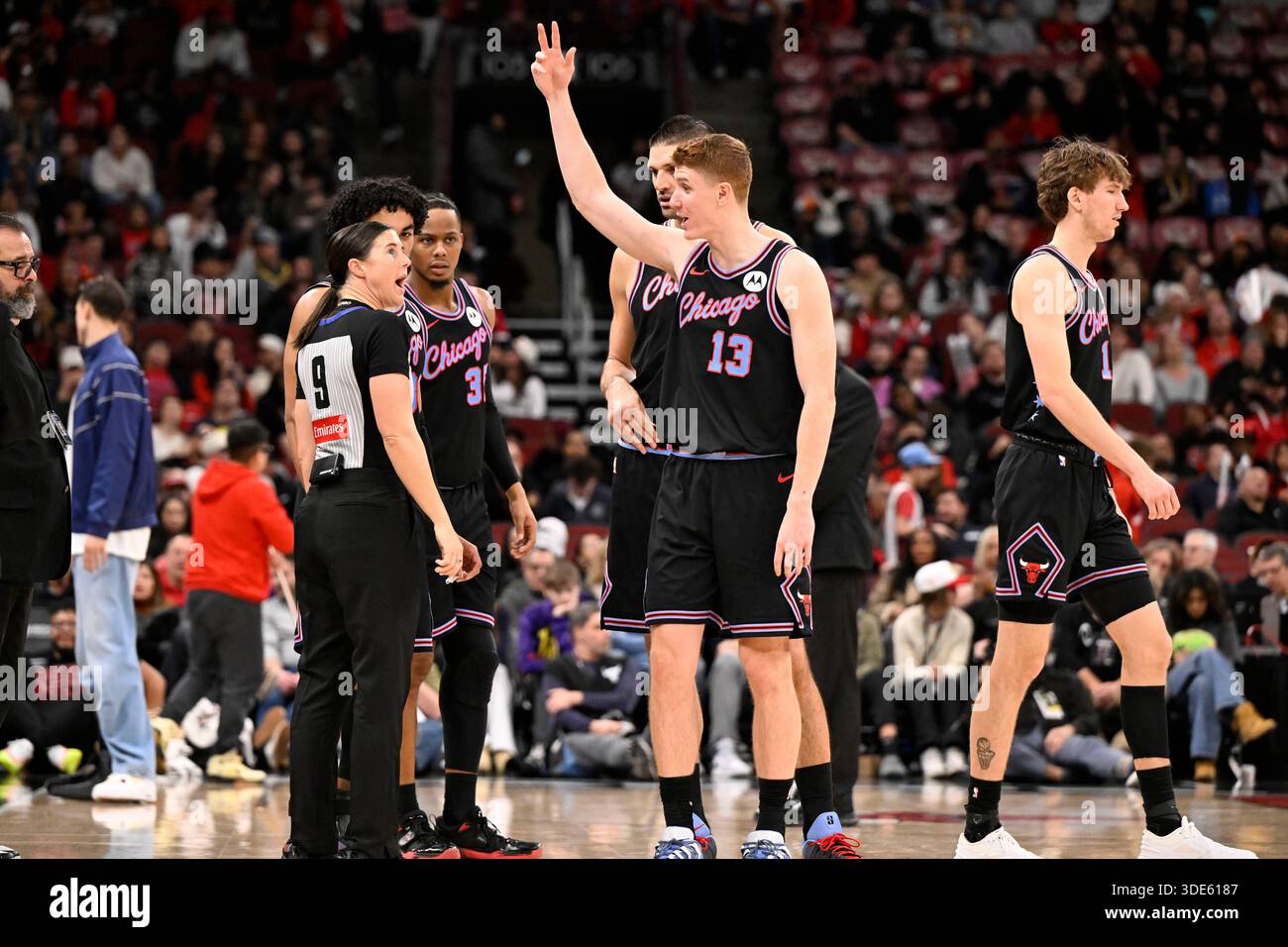 Chicago Bulls guard Kevin Huerter (13) talks with official Natalie Sago ...