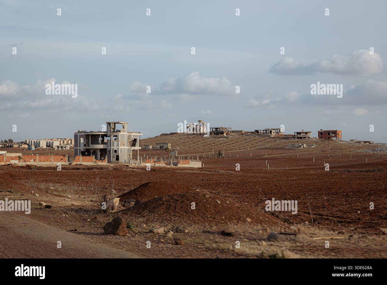 War-damaged buildings dot the landscape near Daraa. Devastating ...