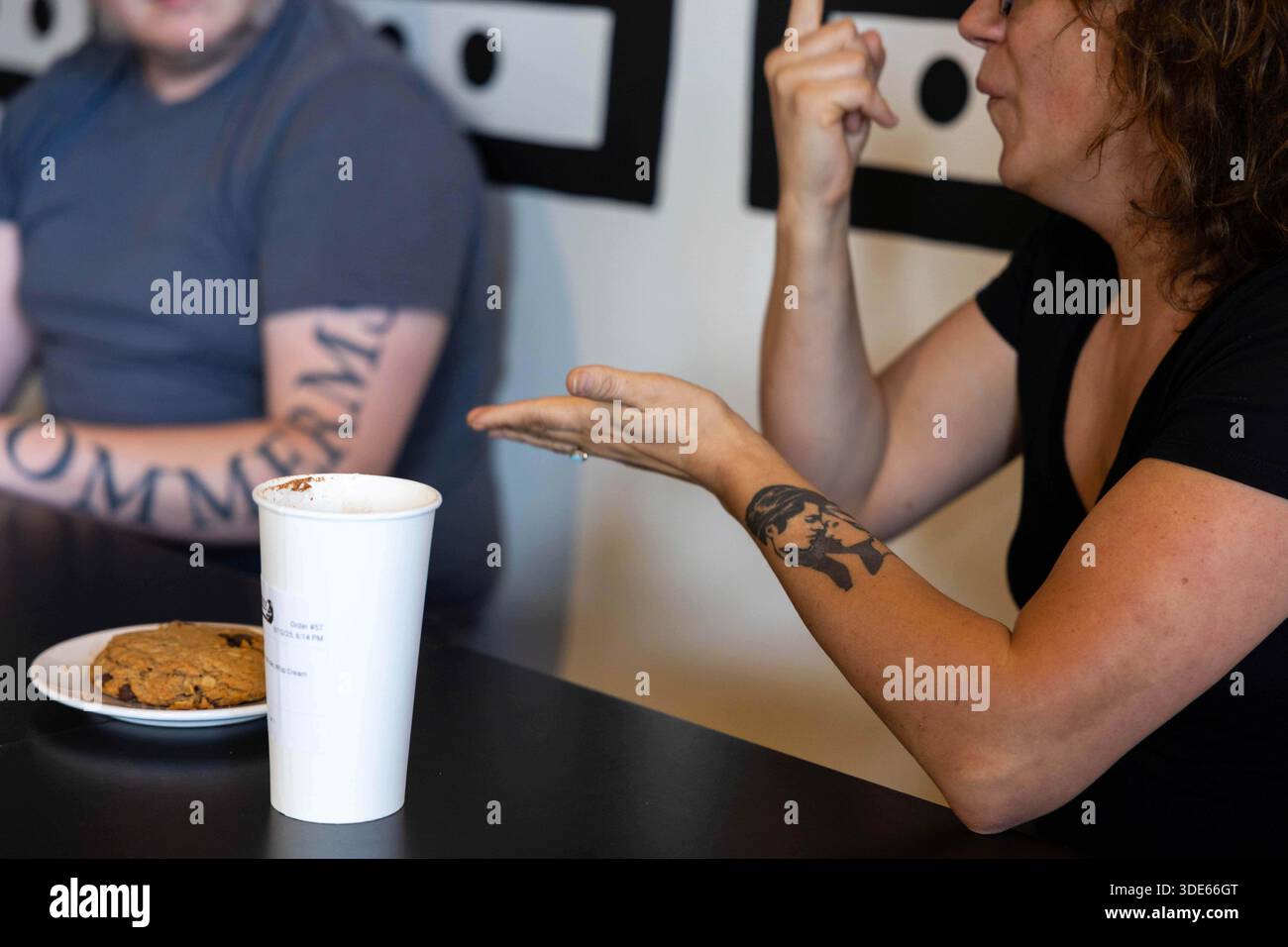 People attending a weekly meet up called "Sign Squad" communicate in ...