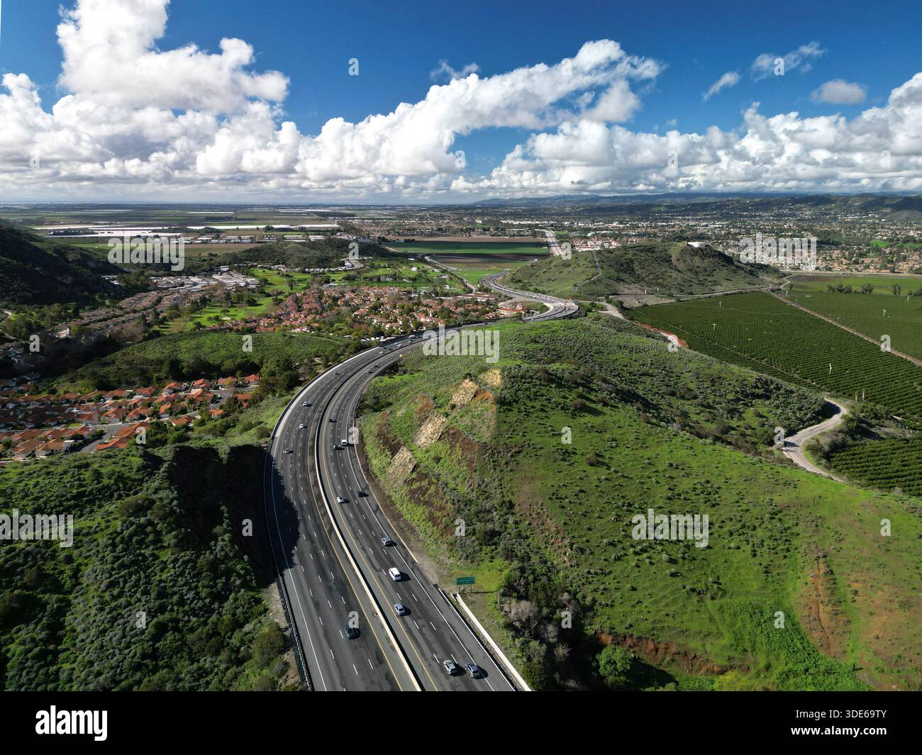 Aerial view of highway 101 descending the Conejo Grade onto the lush ...