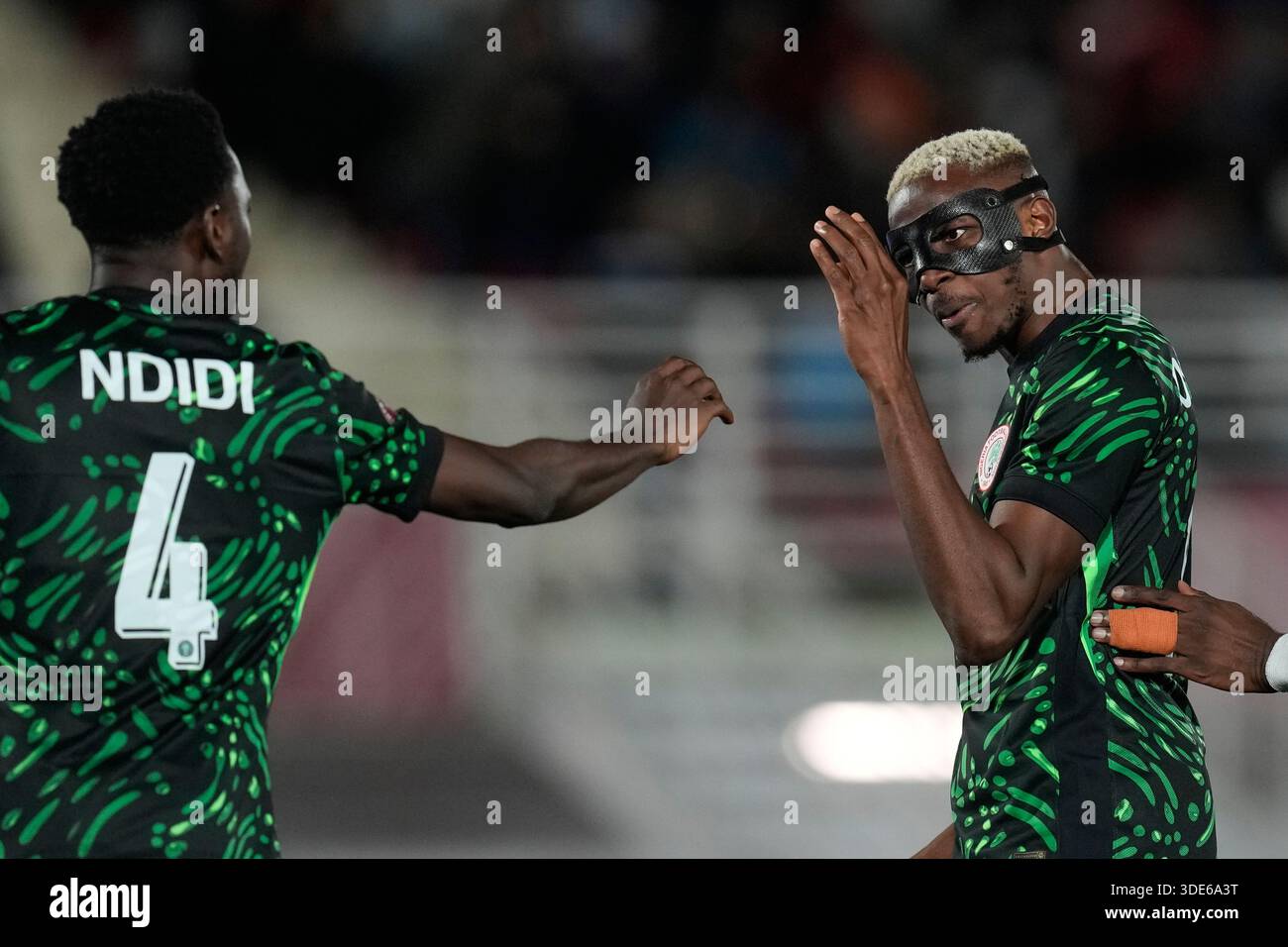Nigeria's Victor Osimhen, right, speaks with Nigeria's Wilfred Ndidi ...