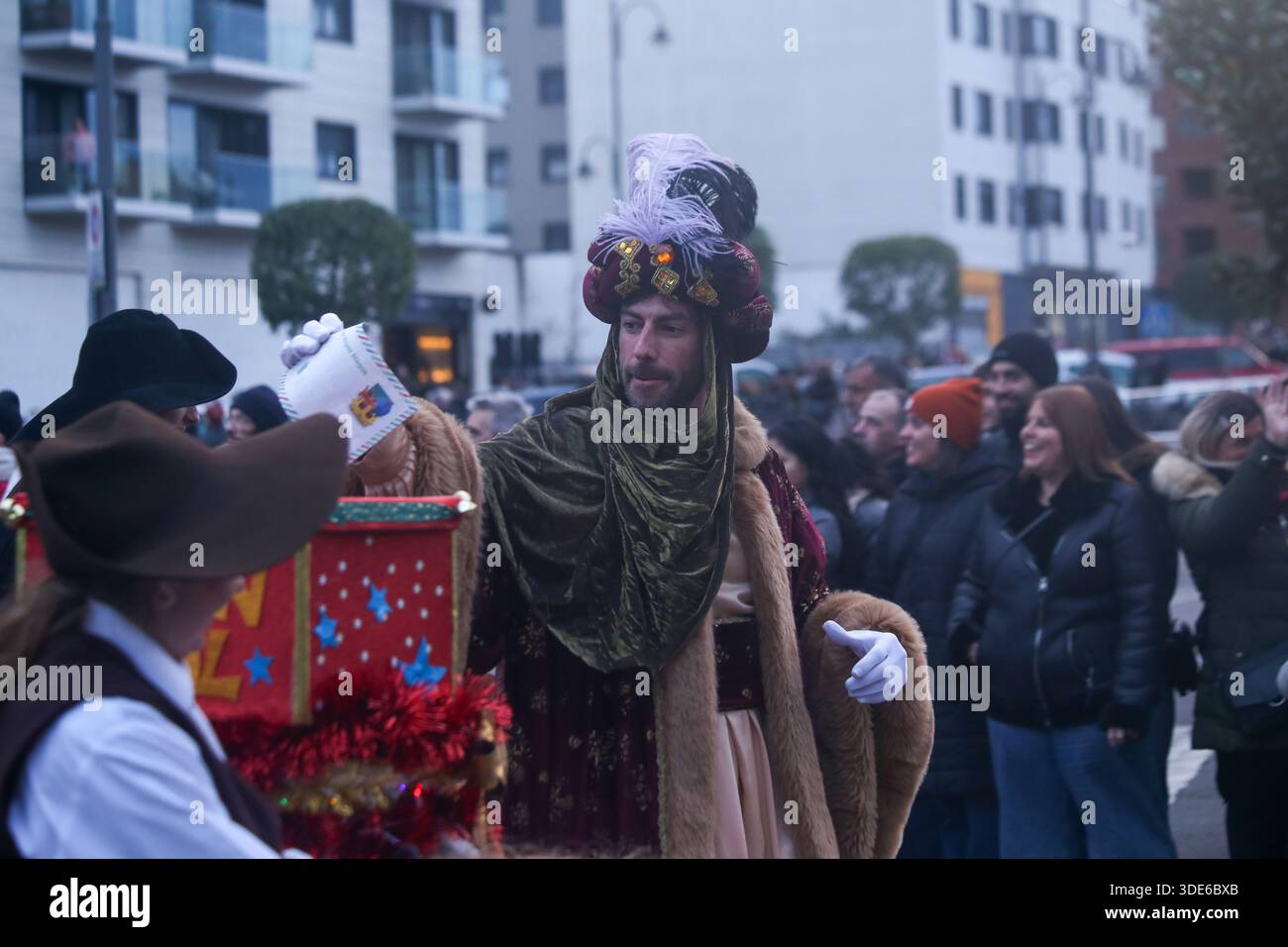 Avilés, Spain, January 5, 2026: Prince Aliatar places a little girl's ...