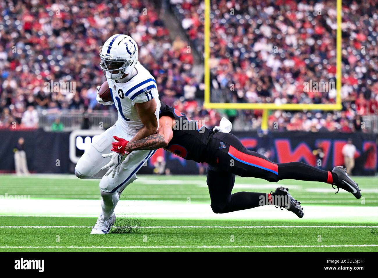 Houston Texans cornerback Alijah Huzzie (36) attempts to tackle ...