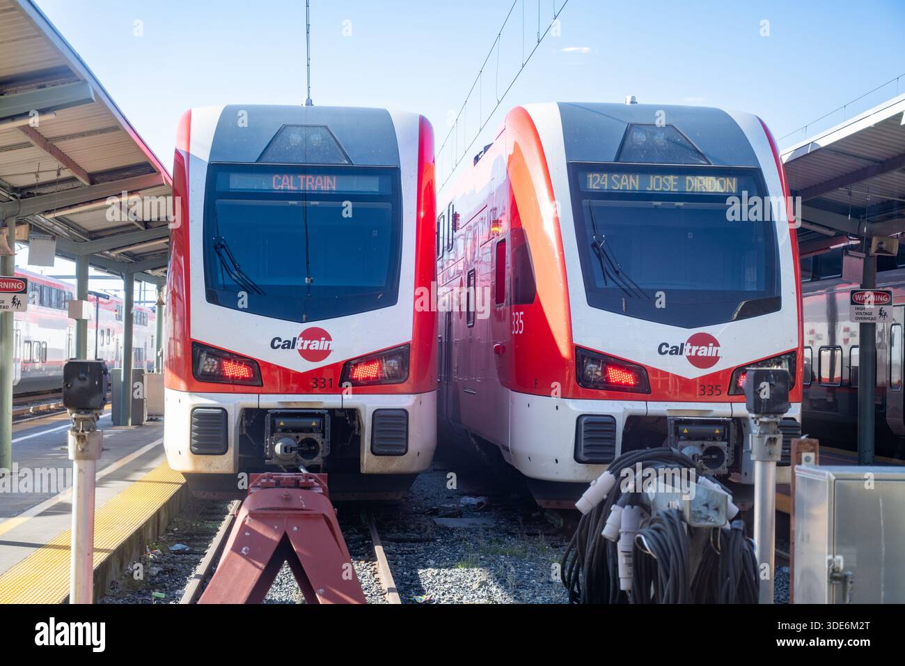 Modern Caltrain electric trains stopped side by side at station ...