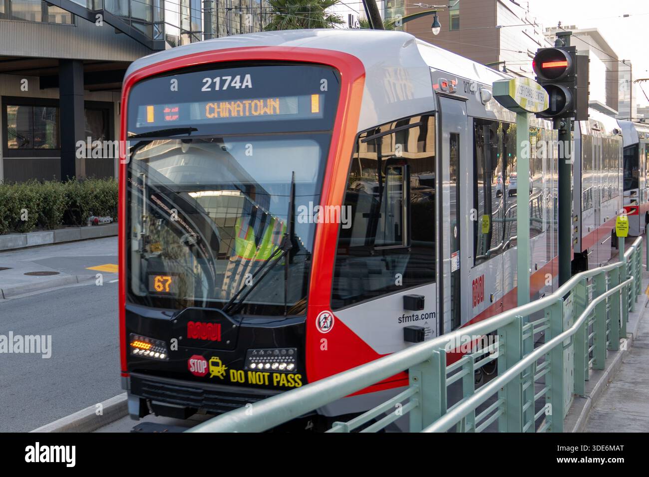 Modern Muni light rail train with Chinatown destination sign at station ...
