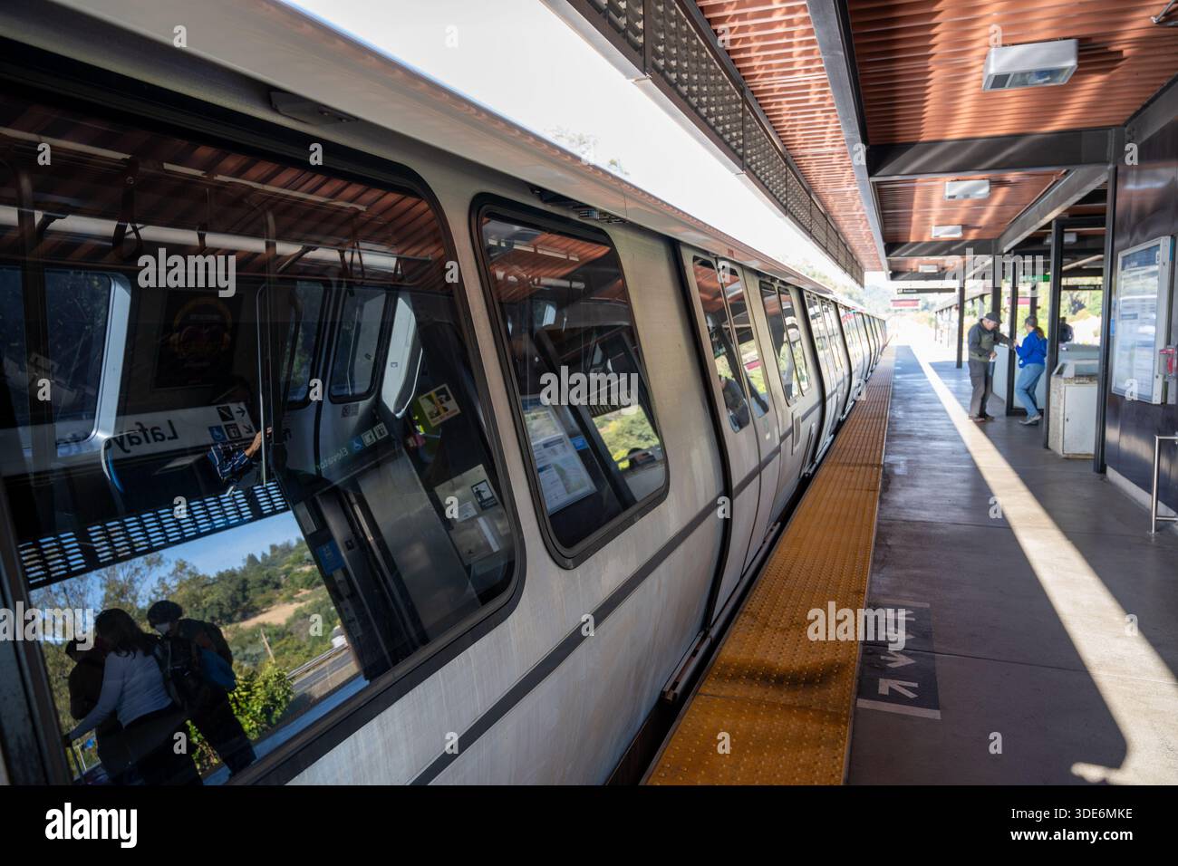 Bay Area Rapid Transit (BART) train at outdoor platform with tactile ...