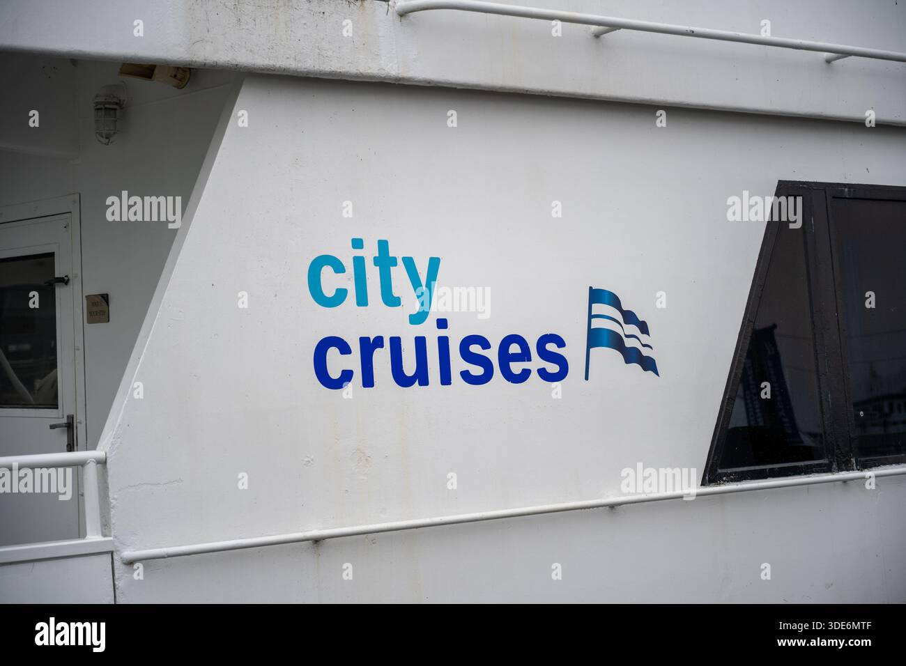 City Cruises logo and flag graphic on exterior side of passenger boat ...