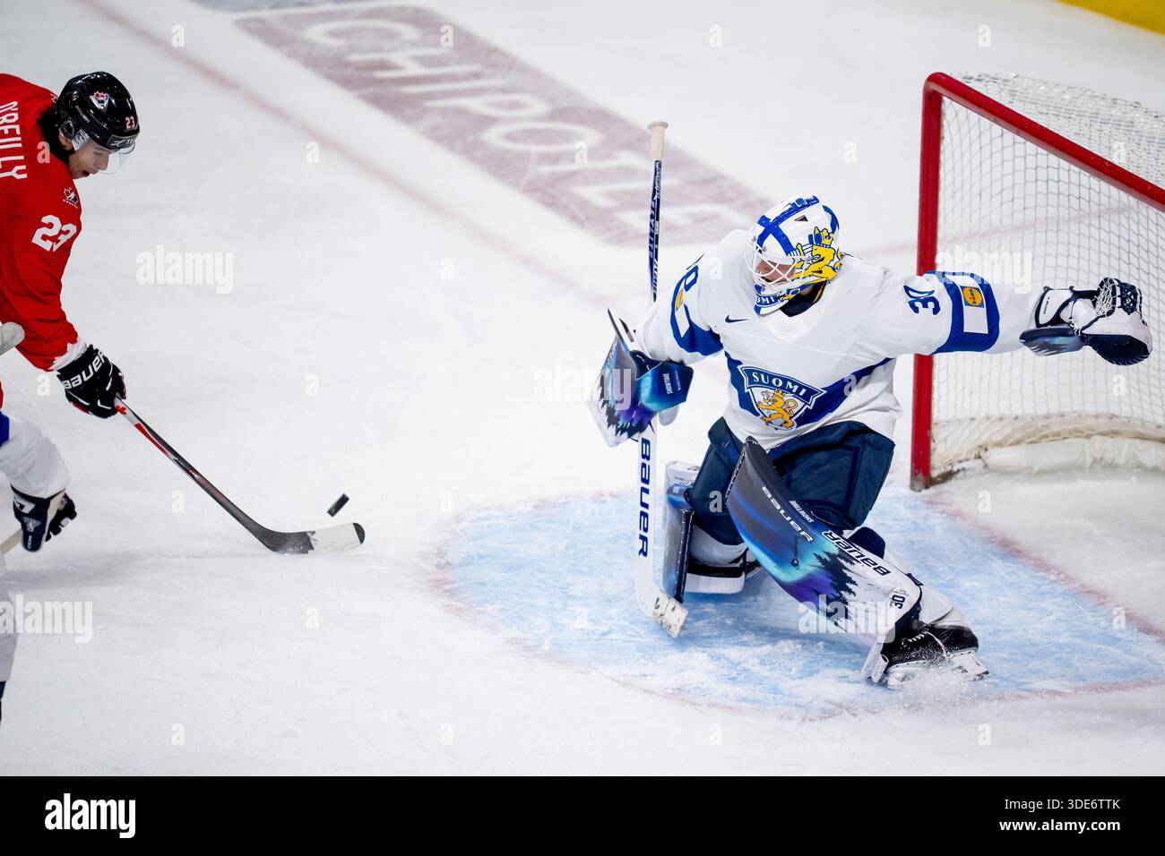 Canada's Sam O'Reilly (23) scores on Finland goaltender Petteri ...