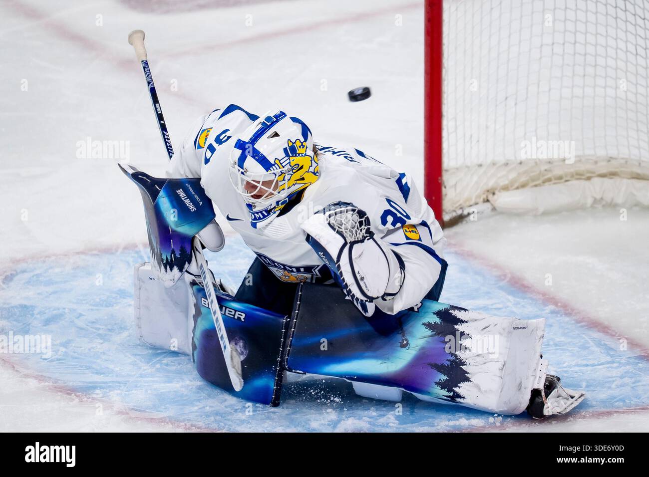 Canadian captain Porter Martone (22), not shown, scores on Finnish ...