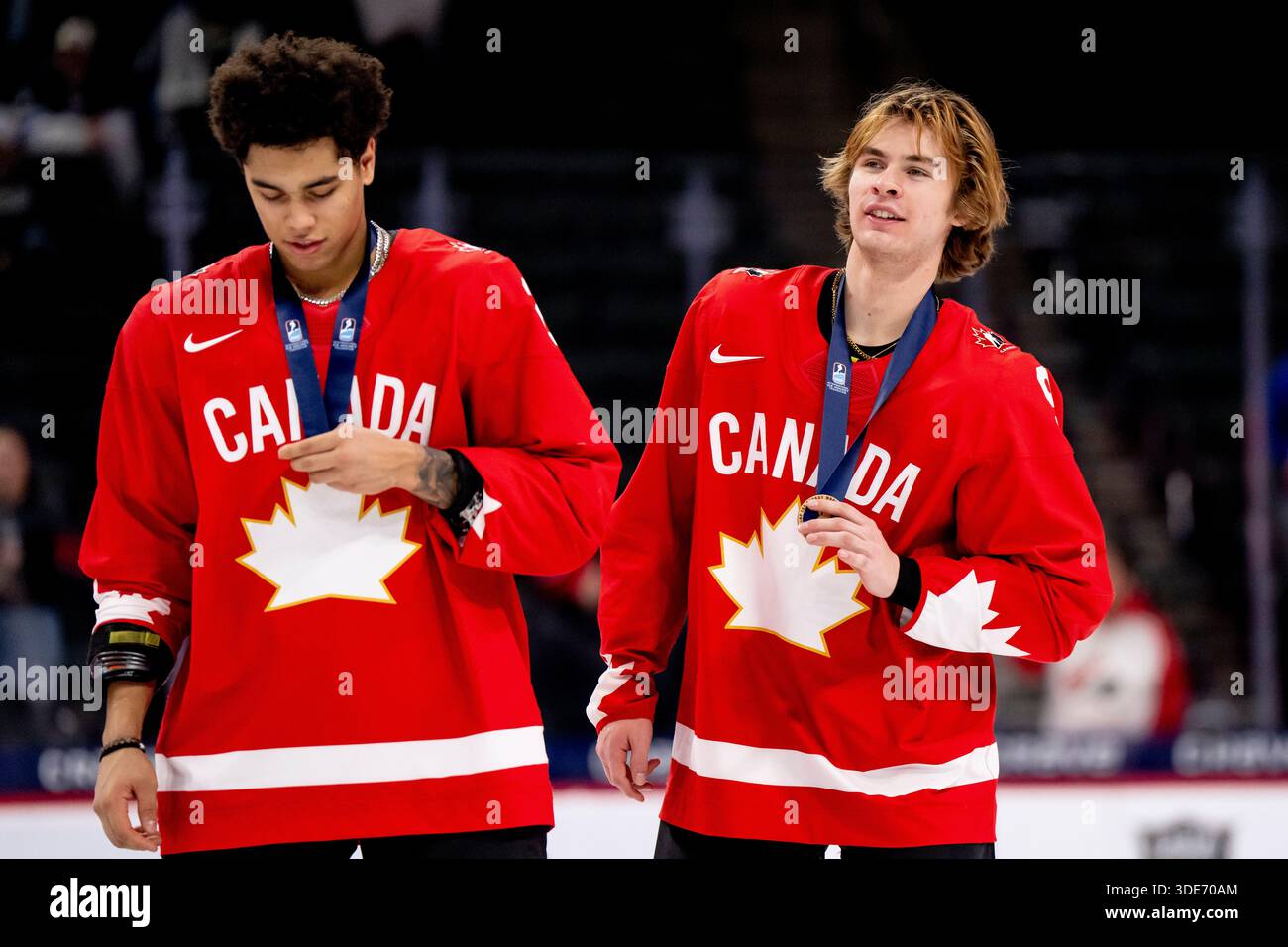 Canada's Kashawn Aitcheson (2), left, and Gavin McKenna (9) celebrate ...