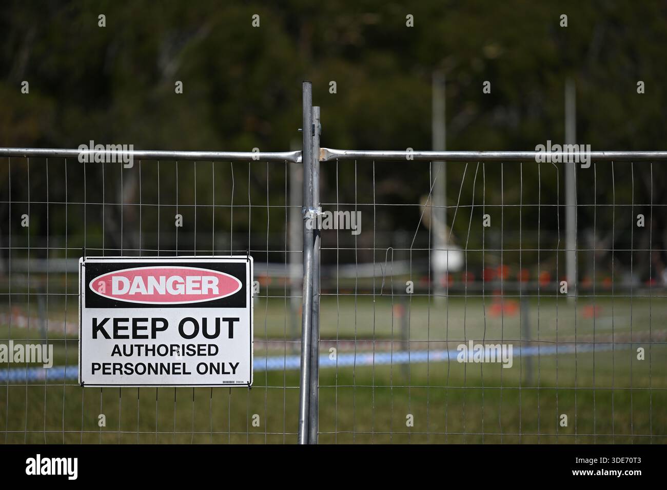 A danger sign is seen at the site of a sinkhole at A J Burkitt Oval in ...