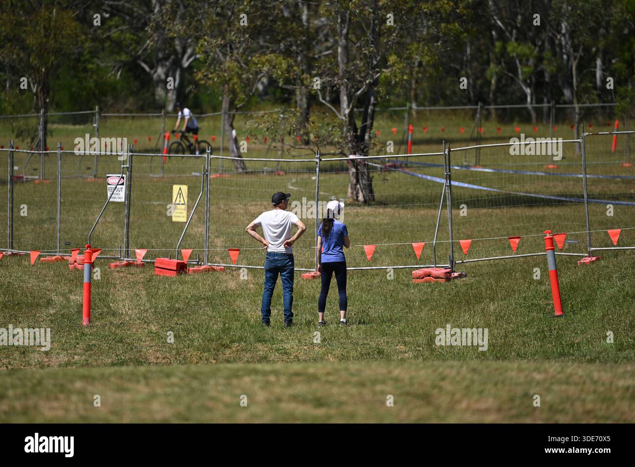 People are seen observing the sinkhole at A J Burkitt Oval in ...