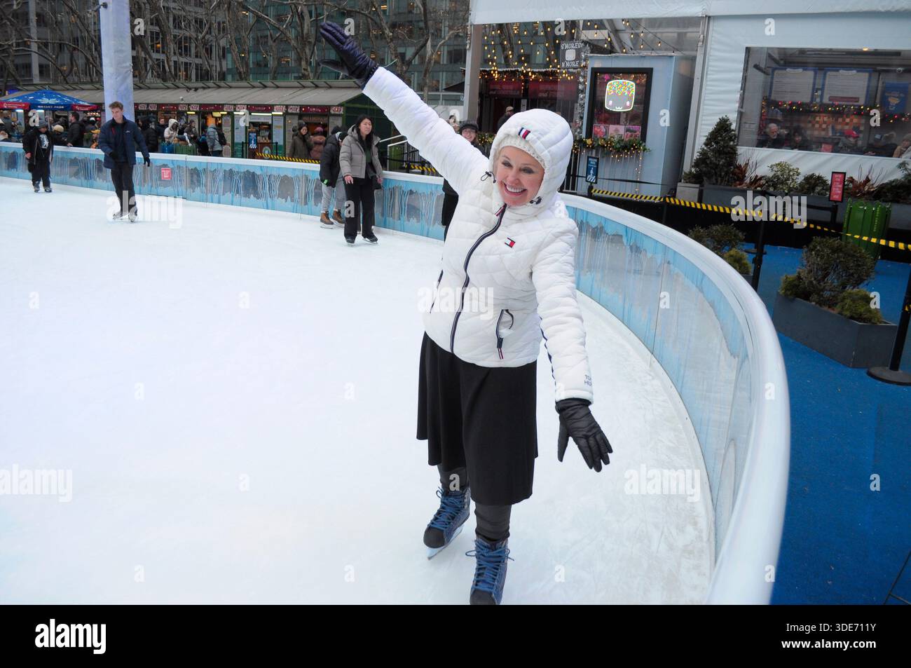 People ice skate in Bryant Park Winter Village, a seasonal holiday ...