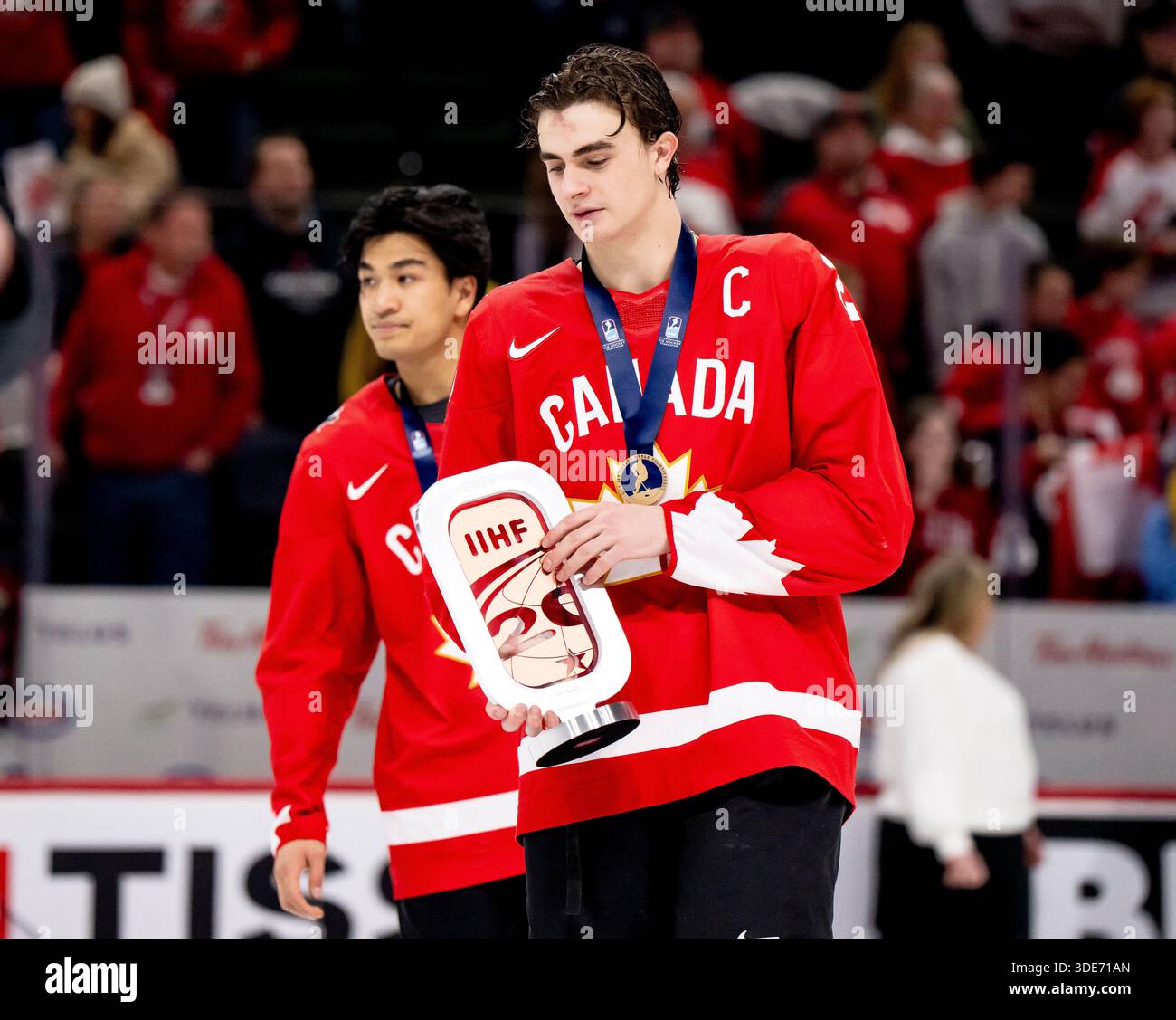 Canada's Zayne Parekh (19), left, and Porter Martone (22) celebrate ...