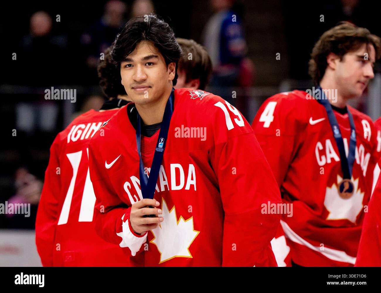 Canada's Zayne Parekh (19), celebrates with teammates after defeating ...