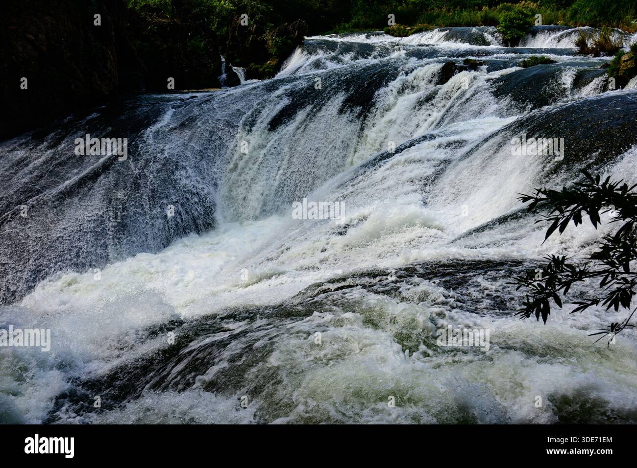 The Silver Chain Waterfall at Huangguoshu cascades into a deep karst ...