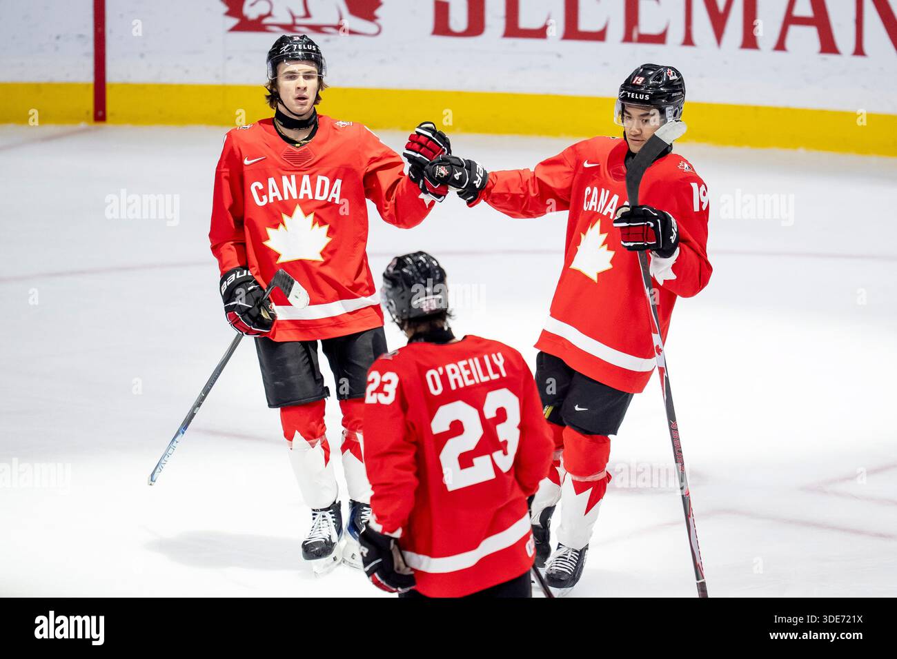 Canada's Gavin McKenna (9) celebrates his goal with teammates Zayne ...