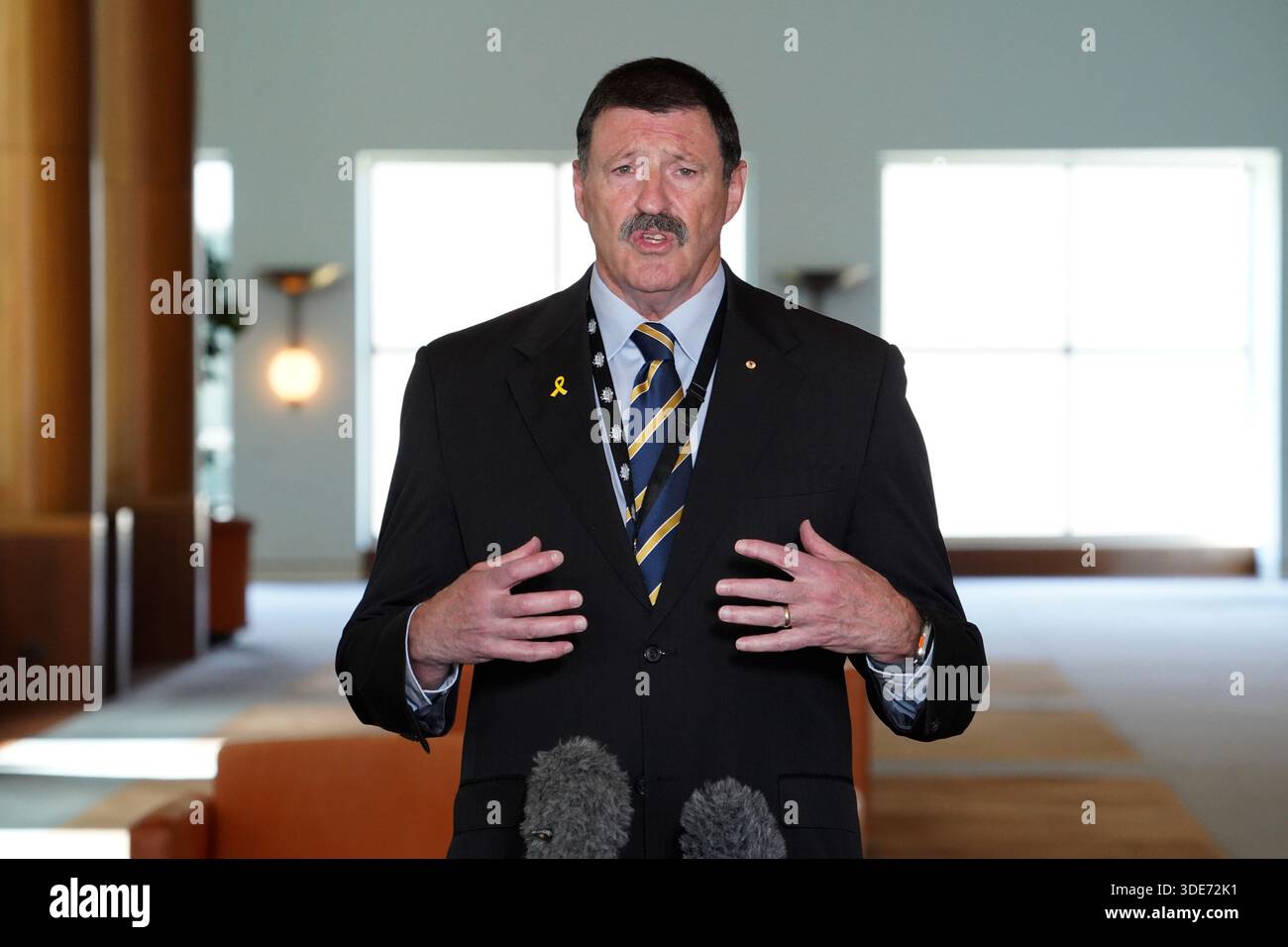 Dr Mike Kelly speaks to media during a press conference at Parliament ...