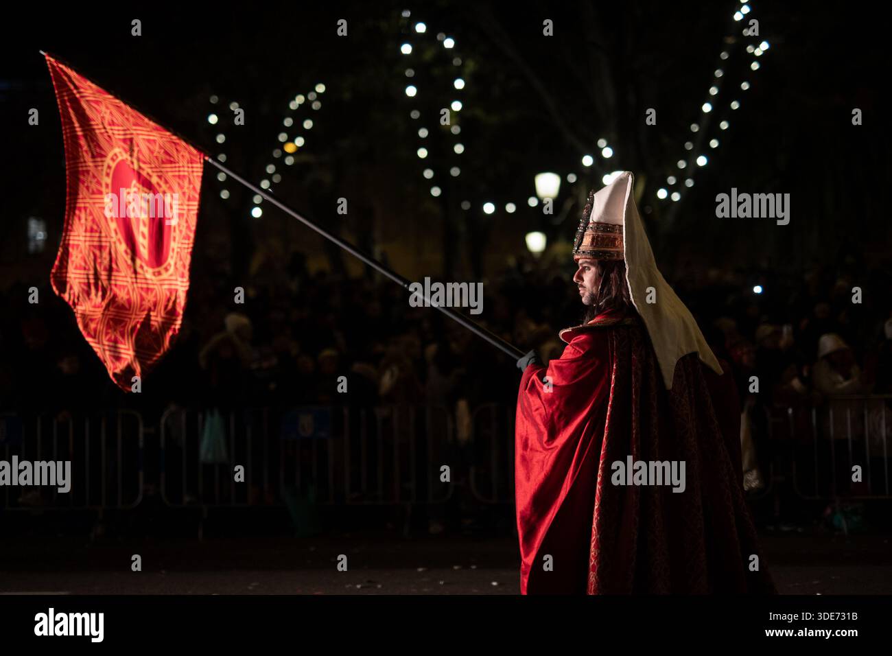 A royal page carries a flag. during the traditional Three Kings Parade ...